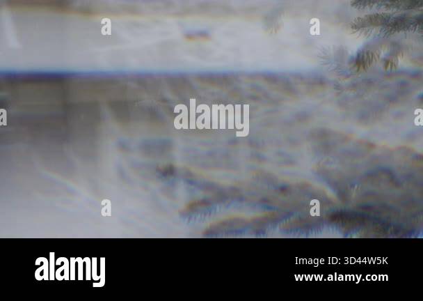 Abstract prism window view of the snowfall outside the house in winter ...