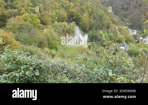serpentine road from Mosel to Hunrueck in autumn colors Stock Video ...