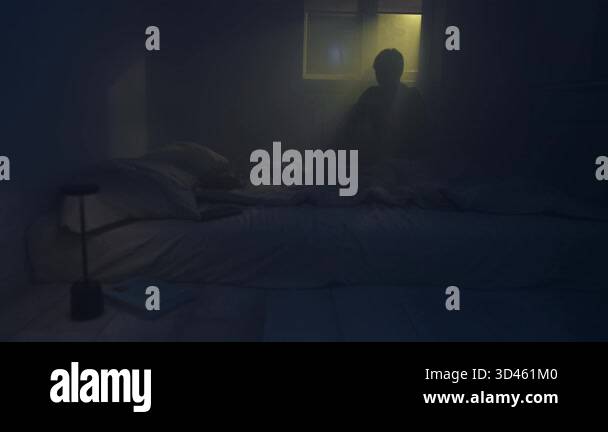 Sad depressed man sitting alone in dark bedroom, emotional burnout ...