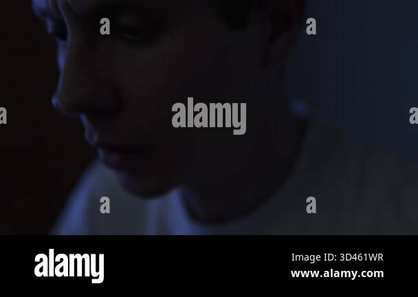 Man suddenly wakes up at night, breathing fast and holding his chest ...