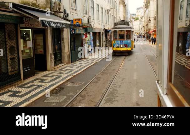 LISBON, circa 2022 - Traveling in the iconic tram 28 along the ...