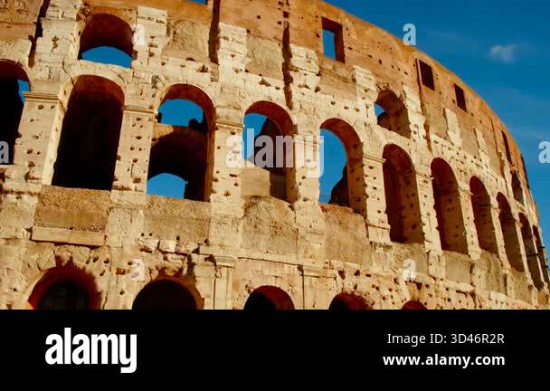 Stunning video of the Colosseum at sunset in Rome, Italy, in warm ...