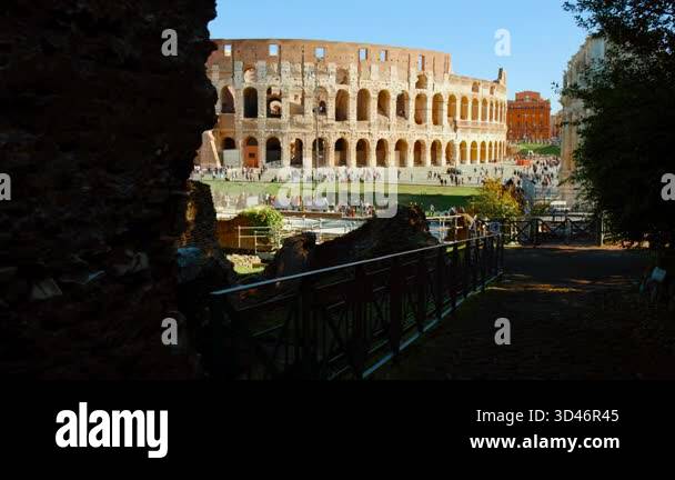 Breathtaking scene of the Colosseum in Rome, Italy, in warm golden ...