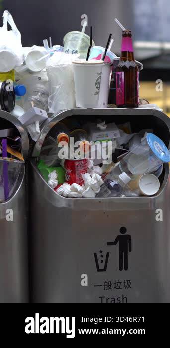 Taipei, Taiwan-13 August, 2017: Trash spilling out of overfilled trash ...