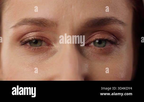 Open eyes woman girl close up face eyelashes blink looking at camera ...