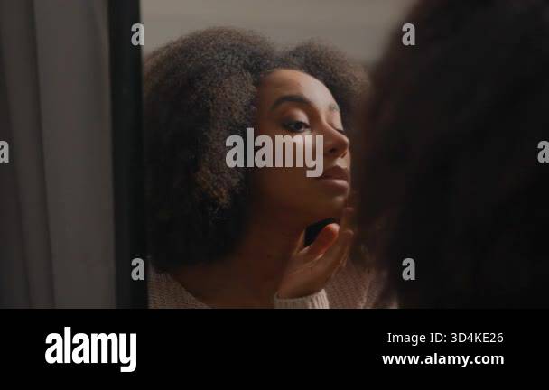 African American girl woman female looking at mirror reflection ...