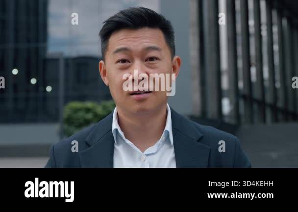 Webcam view portrait happy Asian middle-aged business man talking ...