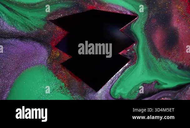 Shiny paint. Sparkling fir tree. Defocused green red purple color ...