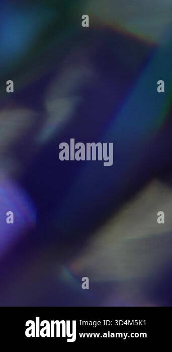 Vertical video. Light beam. Blur rainbow lens. Defocused yellow green ...
