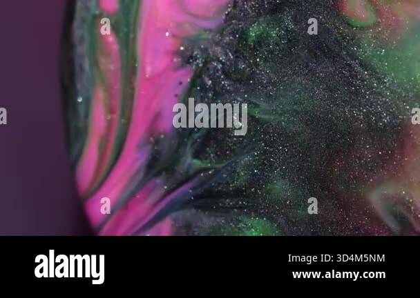 Sparkling wave. Defocused ink swirl. Black pink green shimmering ...