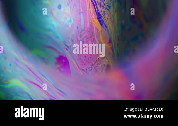 Vertical video. Spectrum defocused ink. Colorful paint planet. Oil soap ...