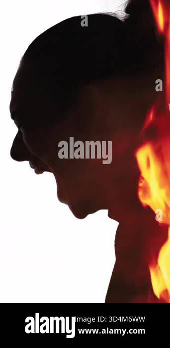 Vertical video. Burning silhouette. Nervous breakdown. Anger fierce ...
