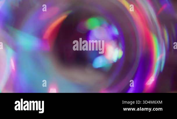 Spectrum light bokeh. Circular glow. Rainbow color shimmering spin in ...