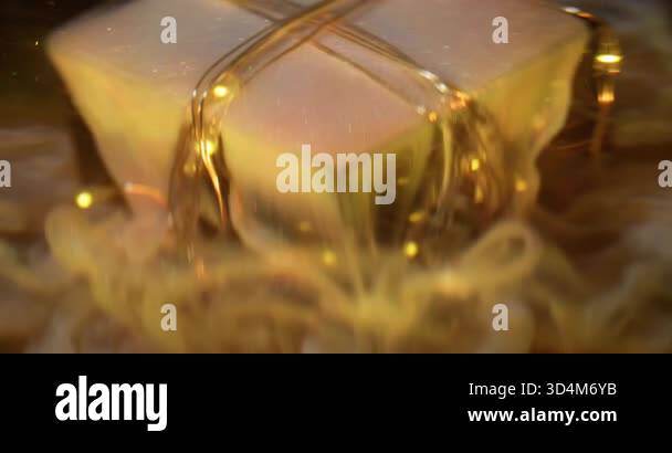 Paint cube. Garland splash. Defocused golden yellow color vapor texture ...