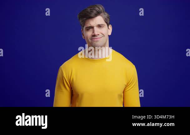 Disappointed man in yellow wear doing facepalm. Feeling regret, failure ...