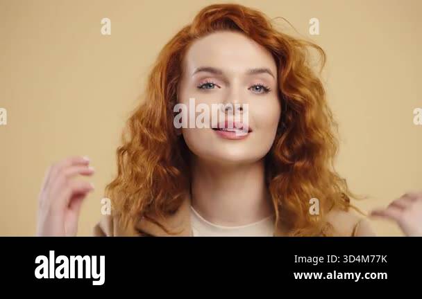 Amazing long curly hair. Gorgeous woman shaking head. Smiling ...