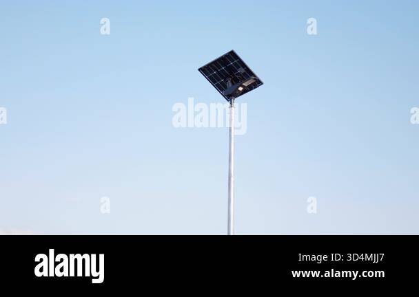Smart street light equipped with solar panel, captured in sequential ...