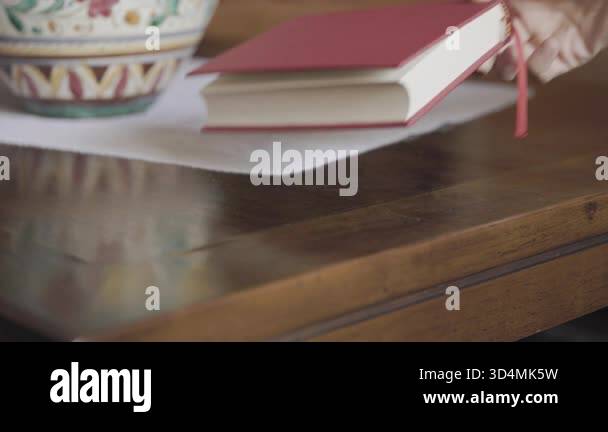 Put books with red cover on wooden table , homework or leisure time ...