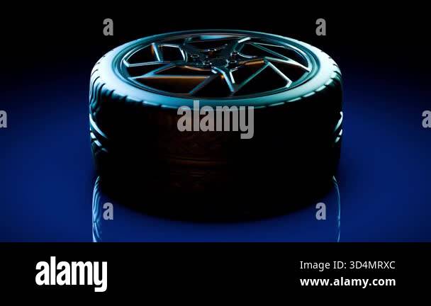 A low profile tyre spins on its side in a controlled studio setup ...