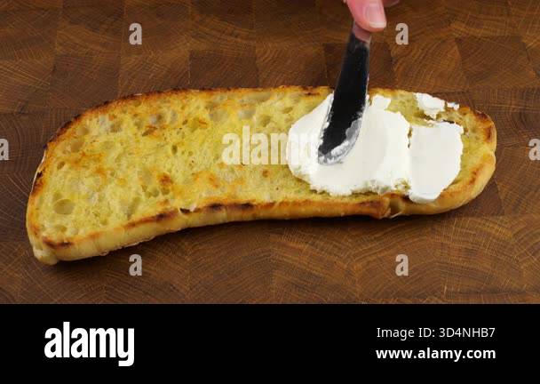 Half of a homemade ciabatta bread, toasted in olive oil and cut ...