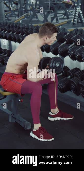 Short biceps dumbbell exercise shown in a gym setting for building ...