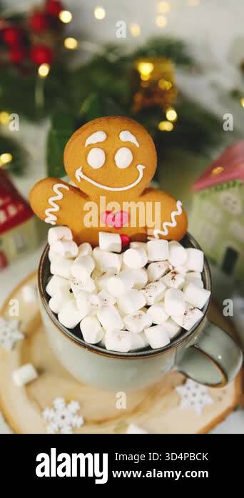 Gingerbread man in hot chocolate with marshmallows and festive ...