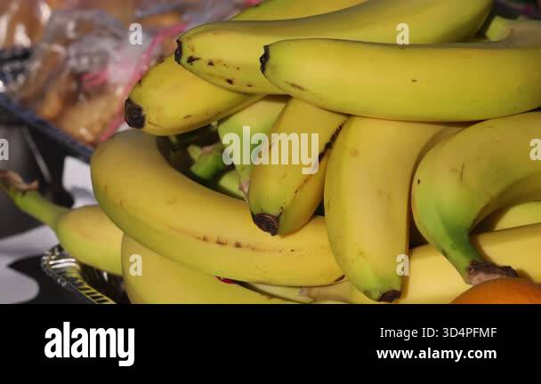 Pile of bananas stacked on market stall showcasing fruit trade and ...
