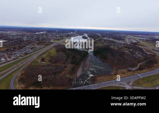 4K drone footage of Quebec highway interchange above river, showing ...