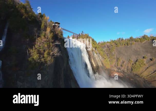 Peaceful cinematic aerial shot of a calm river flowing toward the ...