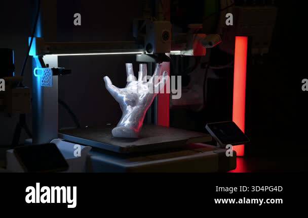 Advanced 3D printer fabricating a transparent prosthetic hand prototype ...