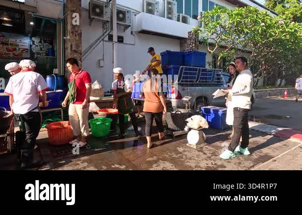 People measuring fish at a market stall Stock Video Footage - Alamy