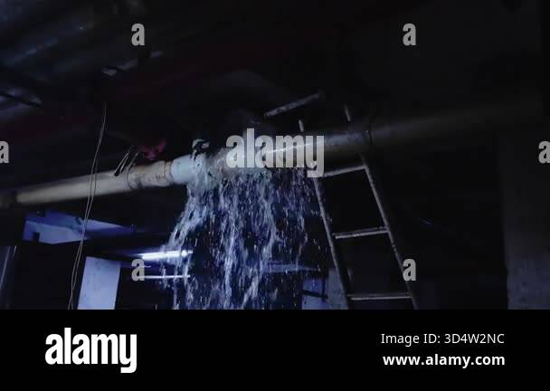 Water pipe burst on supply line, the water flowing down to floor ...
