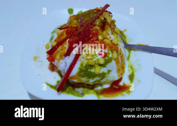 A top-to-bottom moving view reveals raj kachori chaat with curd and ...