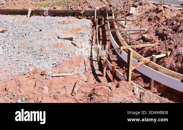 Workers prepare curbed concrete installation Stock Videos & Footage ...