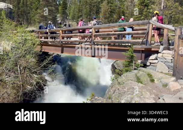 Jackson Hole, Wyoming, USA 28 May 2025: People standing on a bridge ...