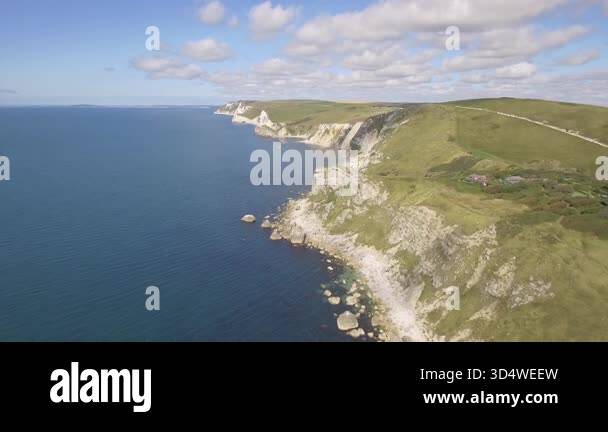 Cornwall aerial drone view of seaside rocky cliffs and turquoise water ...