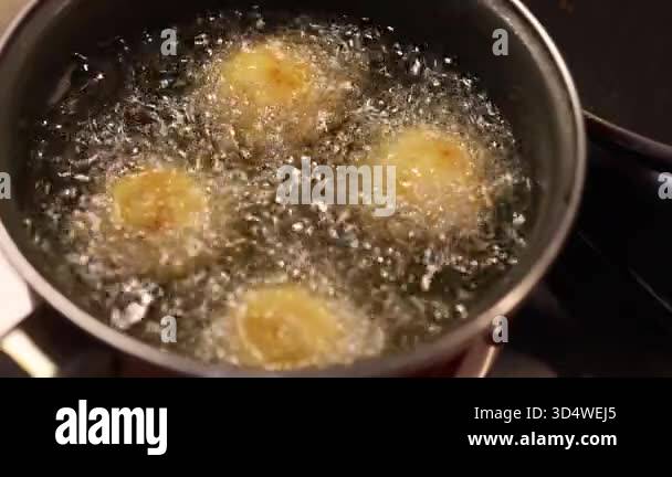 croquettes fried in a frying pan Stock Video Footage - Alamy