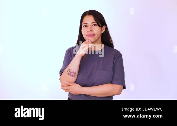 Hispanic Latina woman brunette and a calm expression, wearing a blue T ...