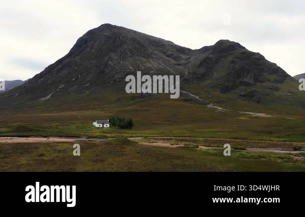 Aerial view of a cottage in a remote location of the highlands in ...