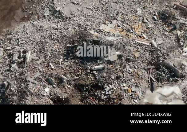 Demolition site, after excavators working on large area of debris and ...