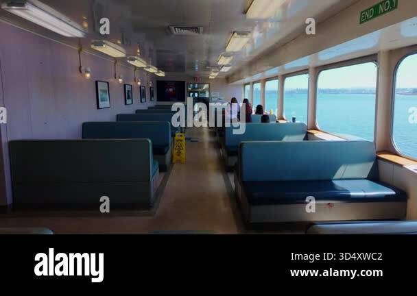 POV walking through the passenger seating area inside a ferry, with ...