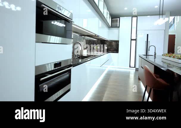 Modern kitchen interior with white cabinets, black marble texture walls ...