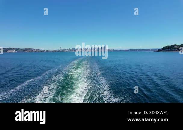 Wake of cruise ship near Seattle coast. Boat creates foam on sea ...