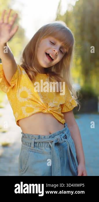 Preteen child kid smiling friendly at camera, waving hands gesturing ...