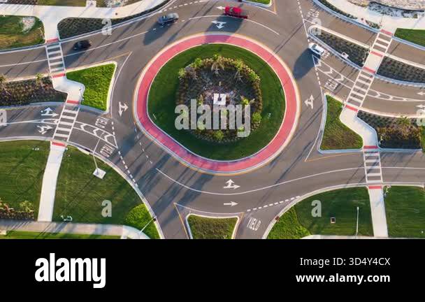 Traffic infrastructure in USA. Road roundabout intersection with ...