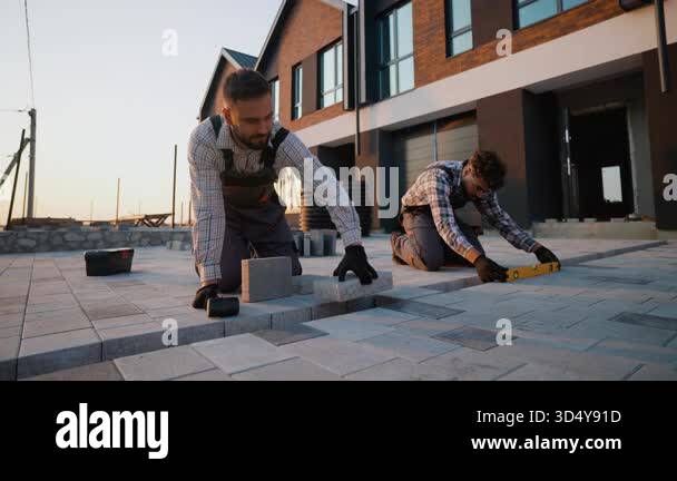 Two multiethnic professional builders working together on a ...