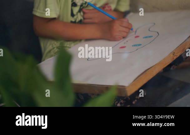 A girl sits in her room and draws Stock Video Footage - Alamy
