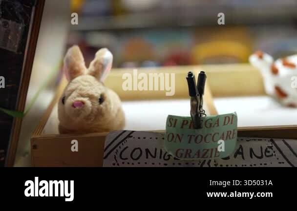 Rome, italy 27 october 2025: cute mechanical rabbit toy with a nodding ...