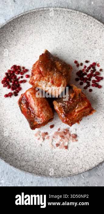 Hake fish cooked in pieces in tomato sauce, stew with peppers and ...