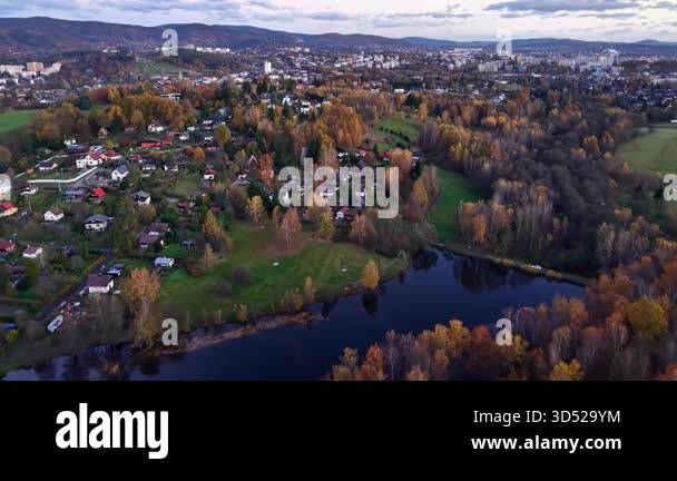 serene lakeside panorama, river curve reflected in calm waters, village ...